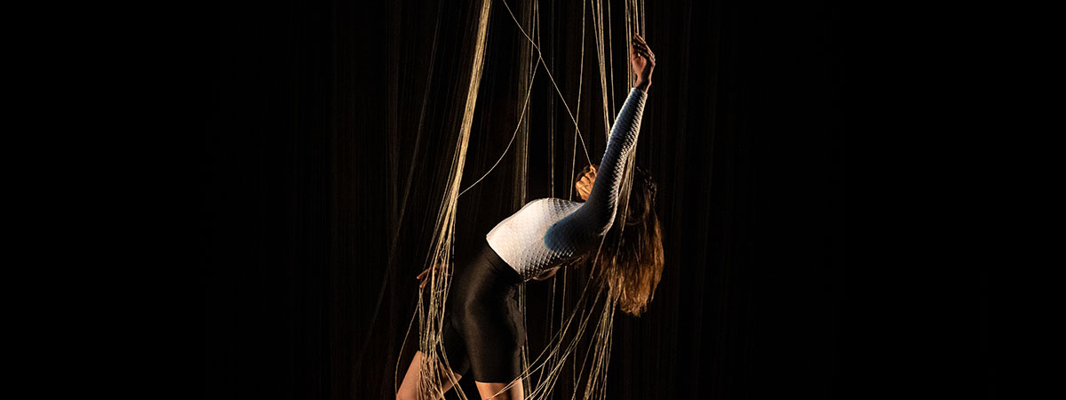 MUTE - Light effects and projection on a string-curtain backdrop