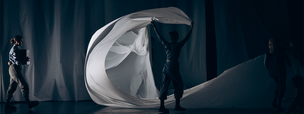 Backlit translucent fabrics define the mood on stage