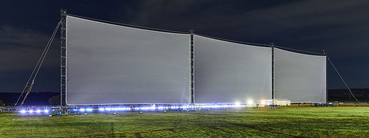 XL video mapping effects on outdoor projection scrims at Sky Song
